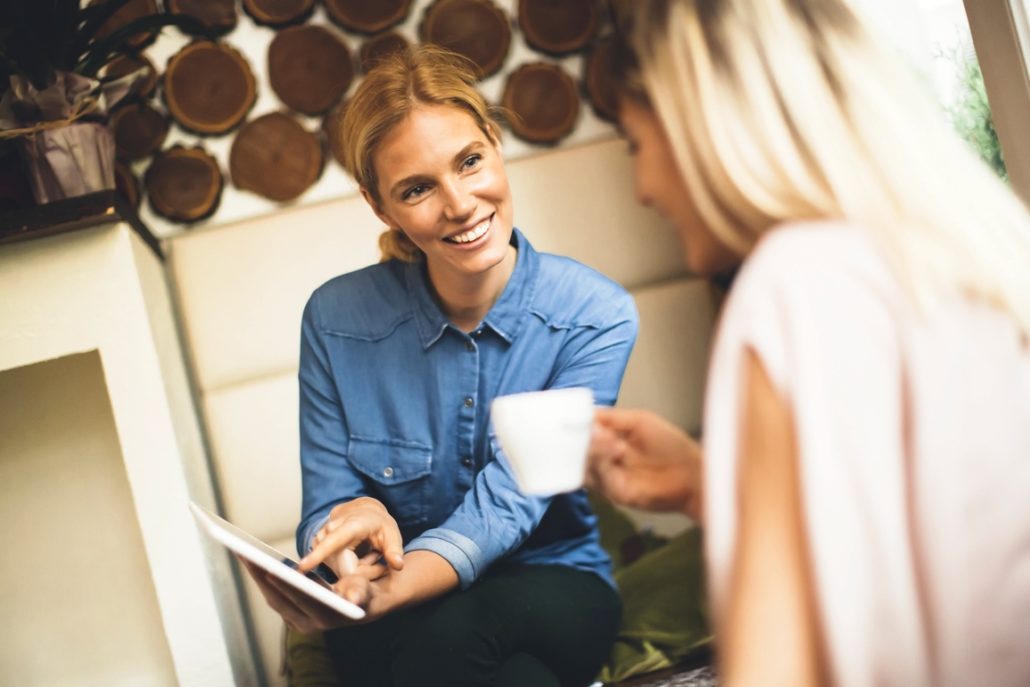 women helping another women - Access Centre Penticton